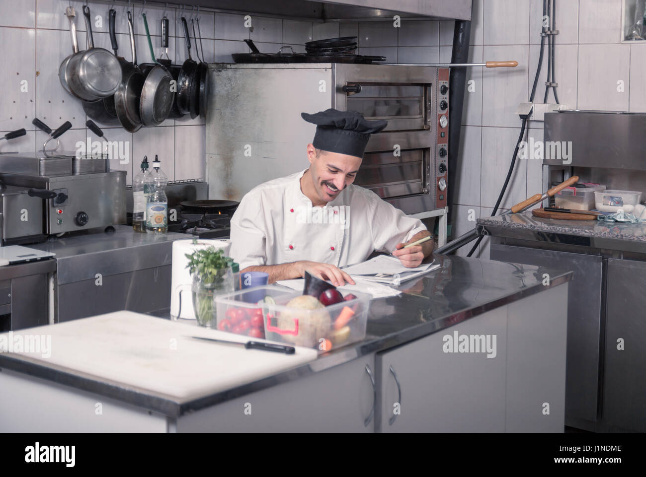 professional one young adult man happy smiling young chef writing ...