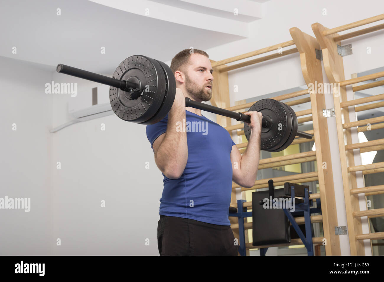 one young adult man only, Weight Bar, fitness, low angle shot view ...