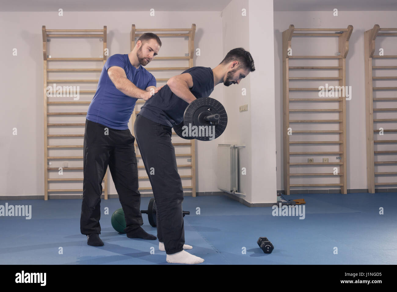 two young men, trainer instructor learning showing educating exercise ...