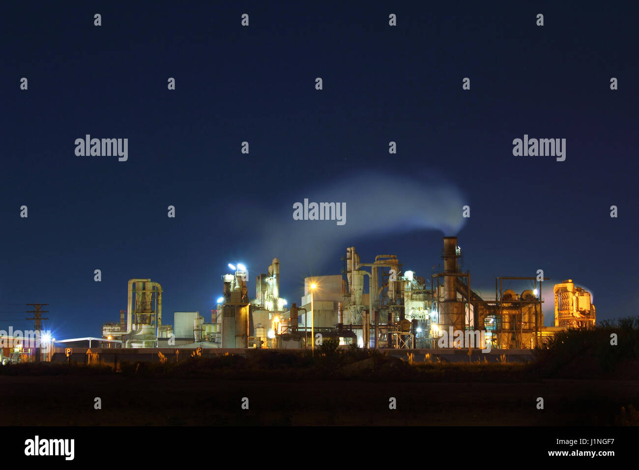Running Factory working at night Stock Photo - Alamy