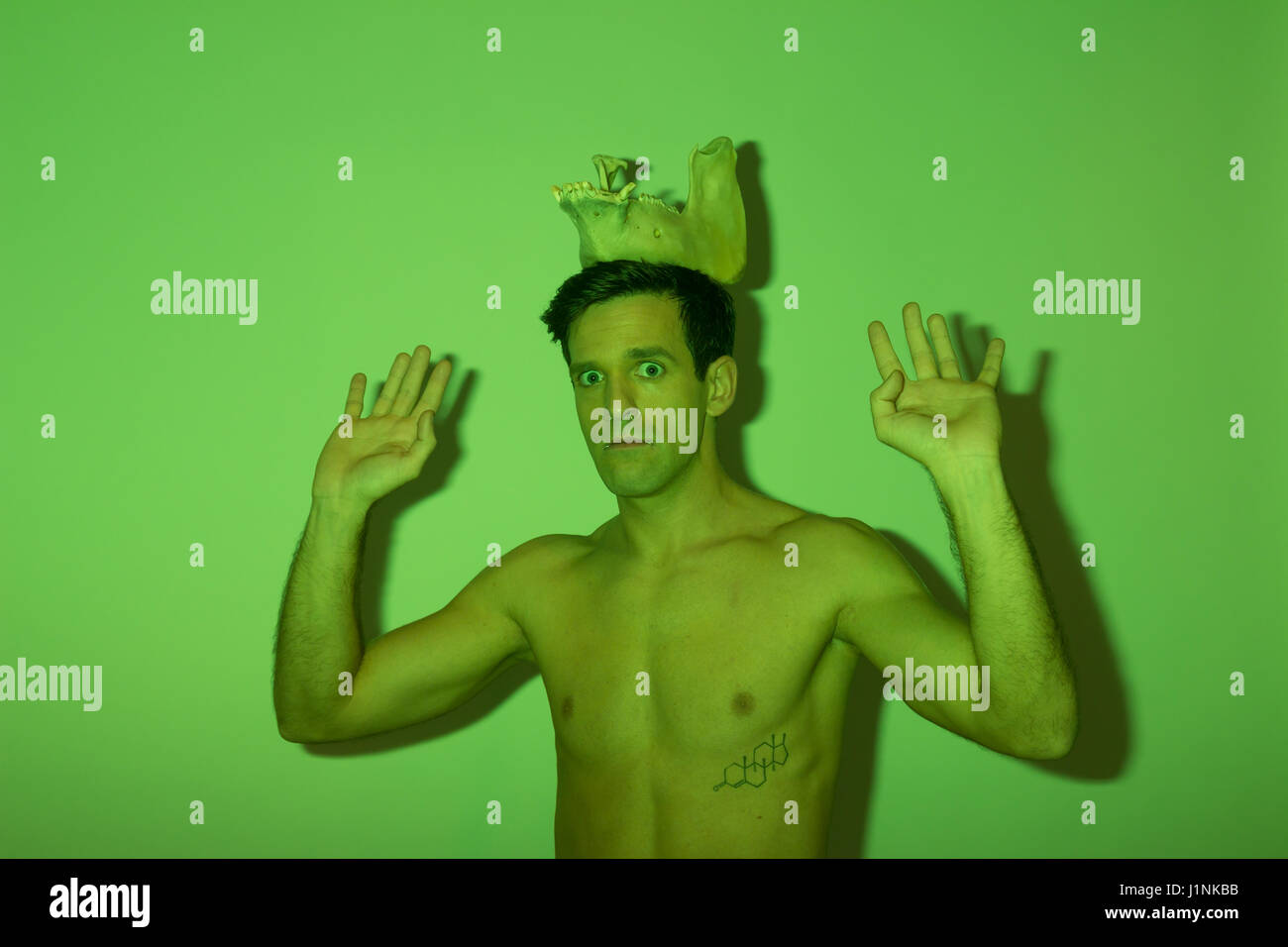 colorful green portrait young man, studio background, silly portrait ...