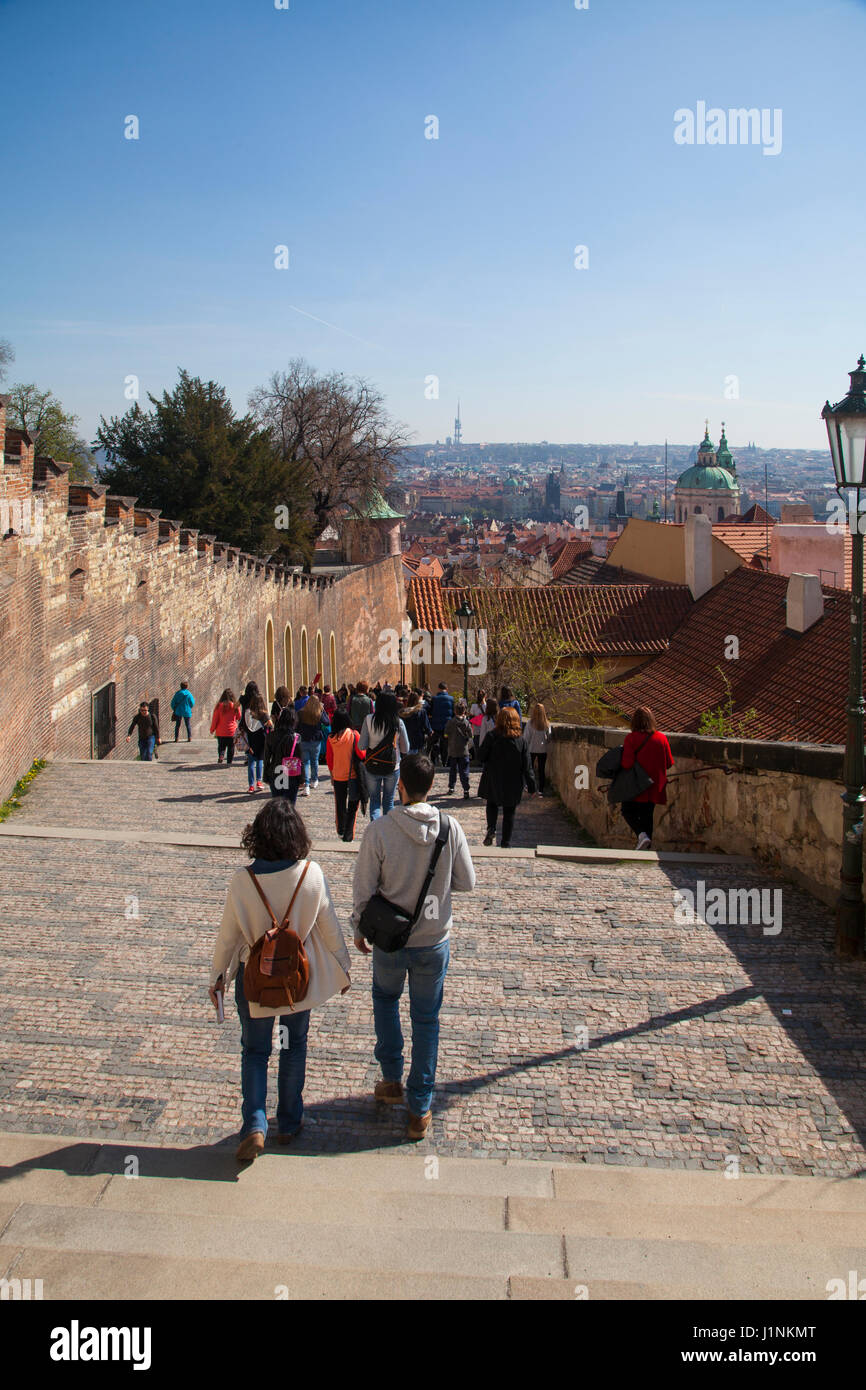 Tourists using the old castle steps from Prague castle down to the ...