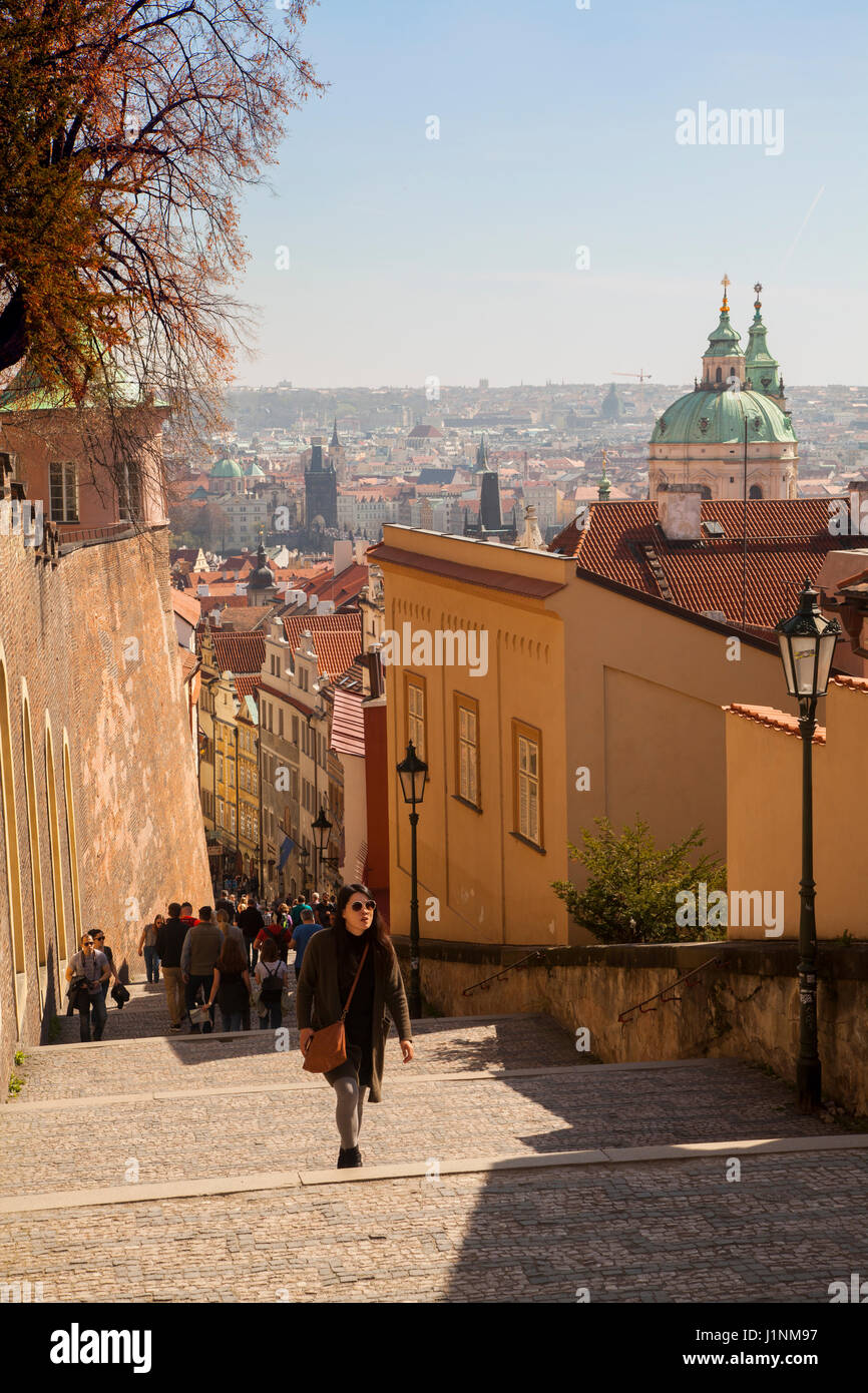 Tourists using the old castle steps from Prague castle down to the ...