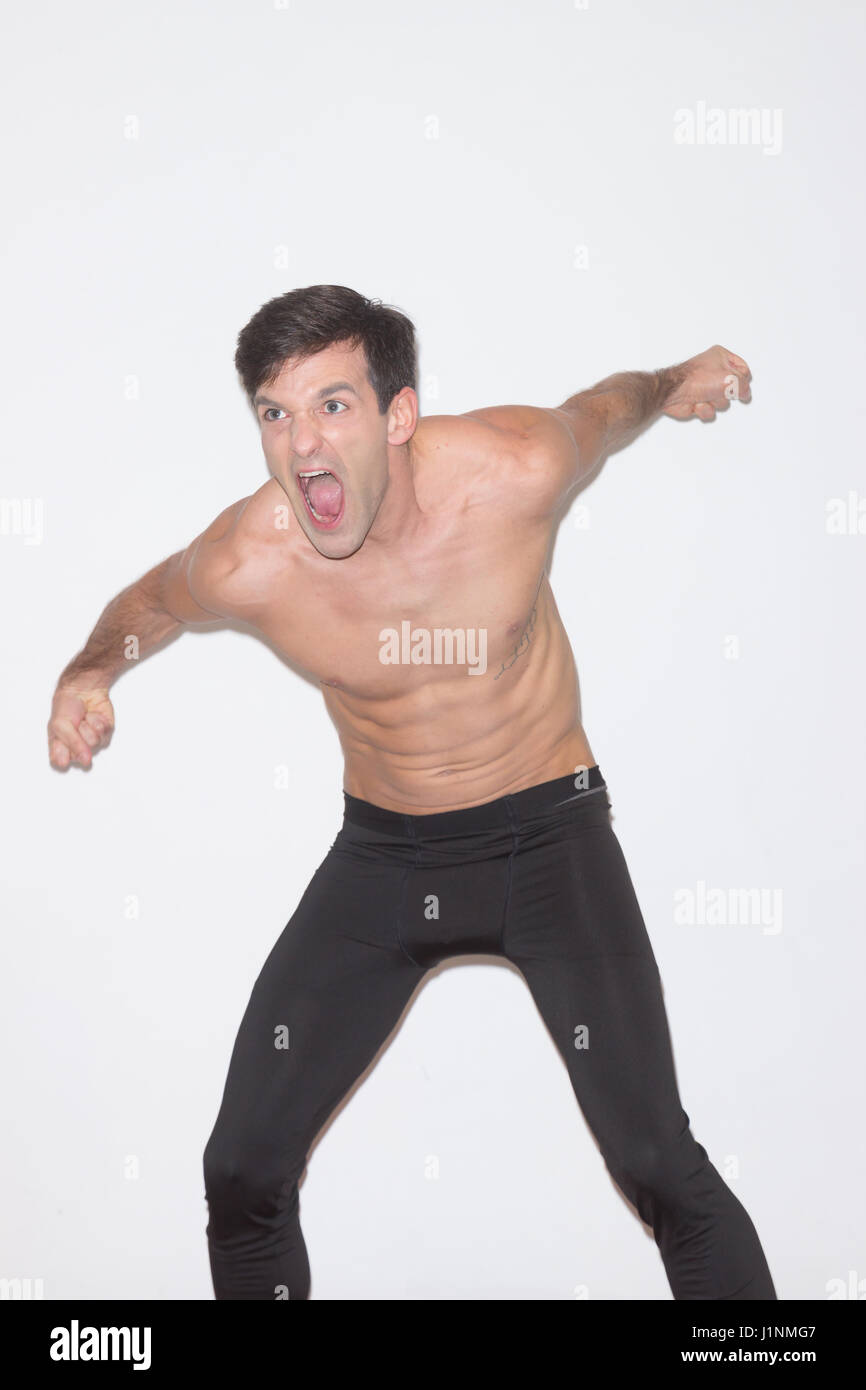 rage angry silly, young man, posing. Studio white background Stock ...