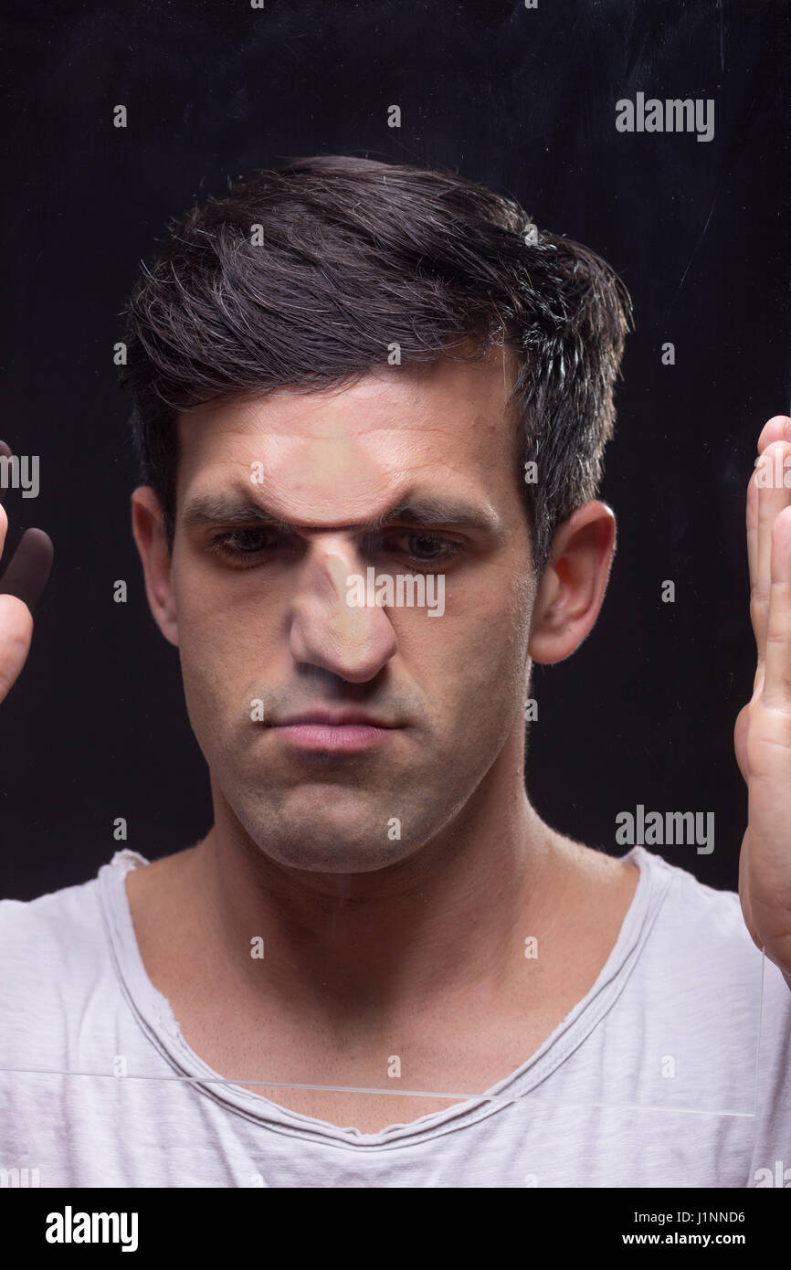 Face pressed against glass hi-res stock photography and images - Alamy