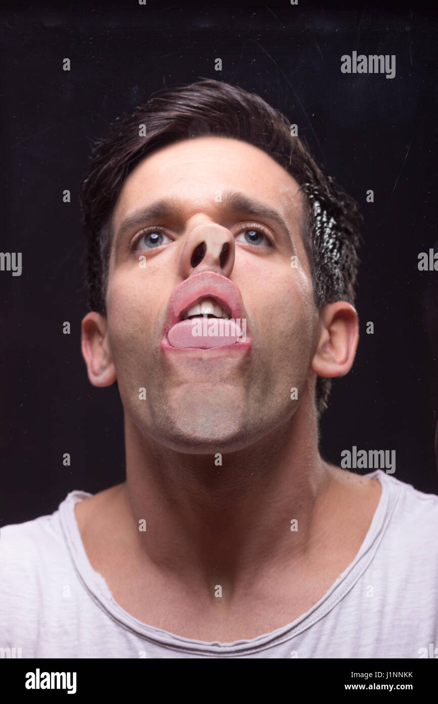 Face pressed against glass hi-res stock photography and images - Alamy