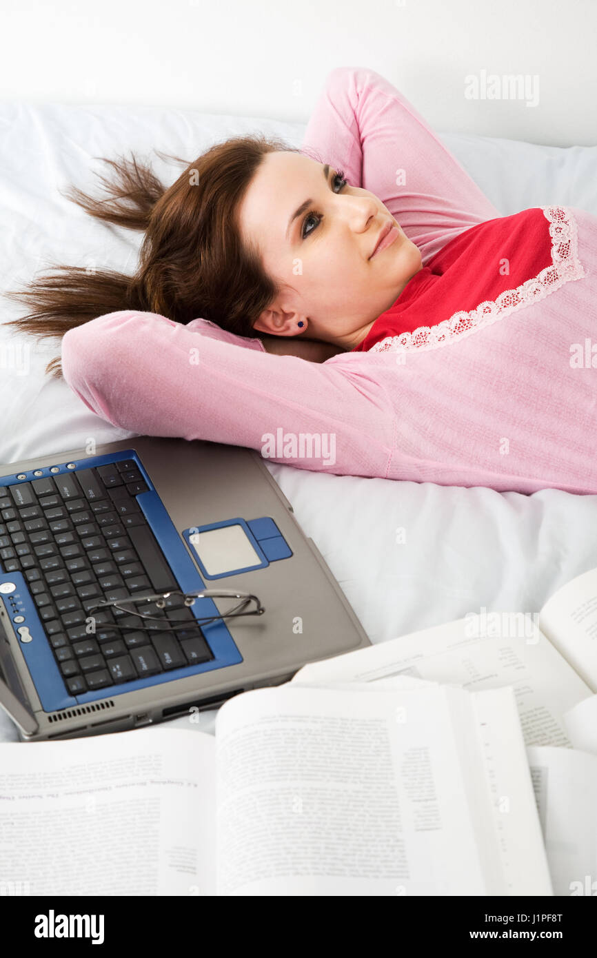 A caucasian female student taking a break from studying Stock Photo - Alamy