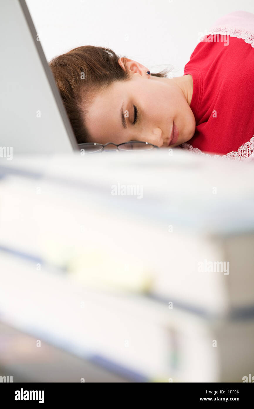 A caucasian female student falls asleep while studying Stock Photo - Alamy