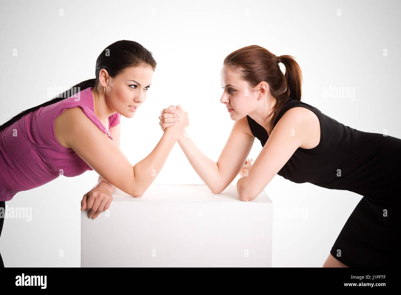 An shot of two businesswomen arm wrestling Stock Photo - Alamy