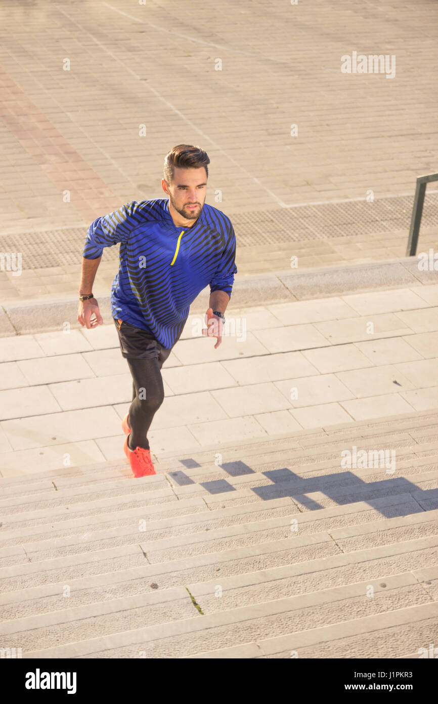 young man athlete runner exercise stairs steps outdoors Stock Photo - Alamy