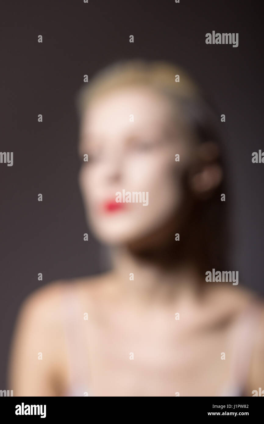 Out of focus, defocused lens, blur. Young woman portrait, head, face ...