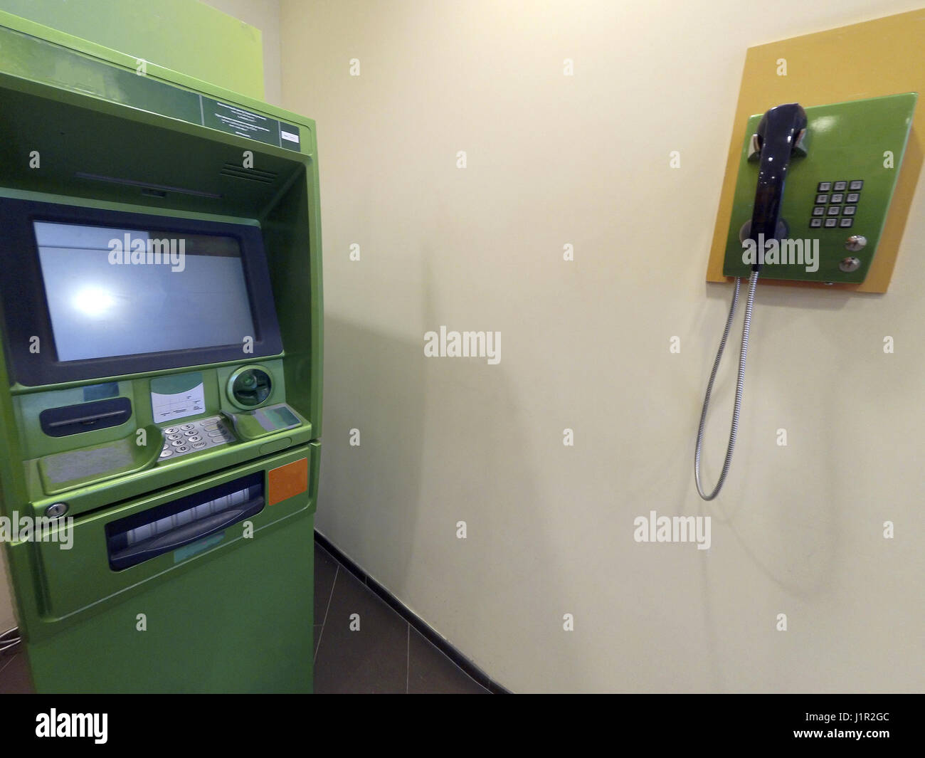 ATM for issuing money and the phone is green at the point of service ...