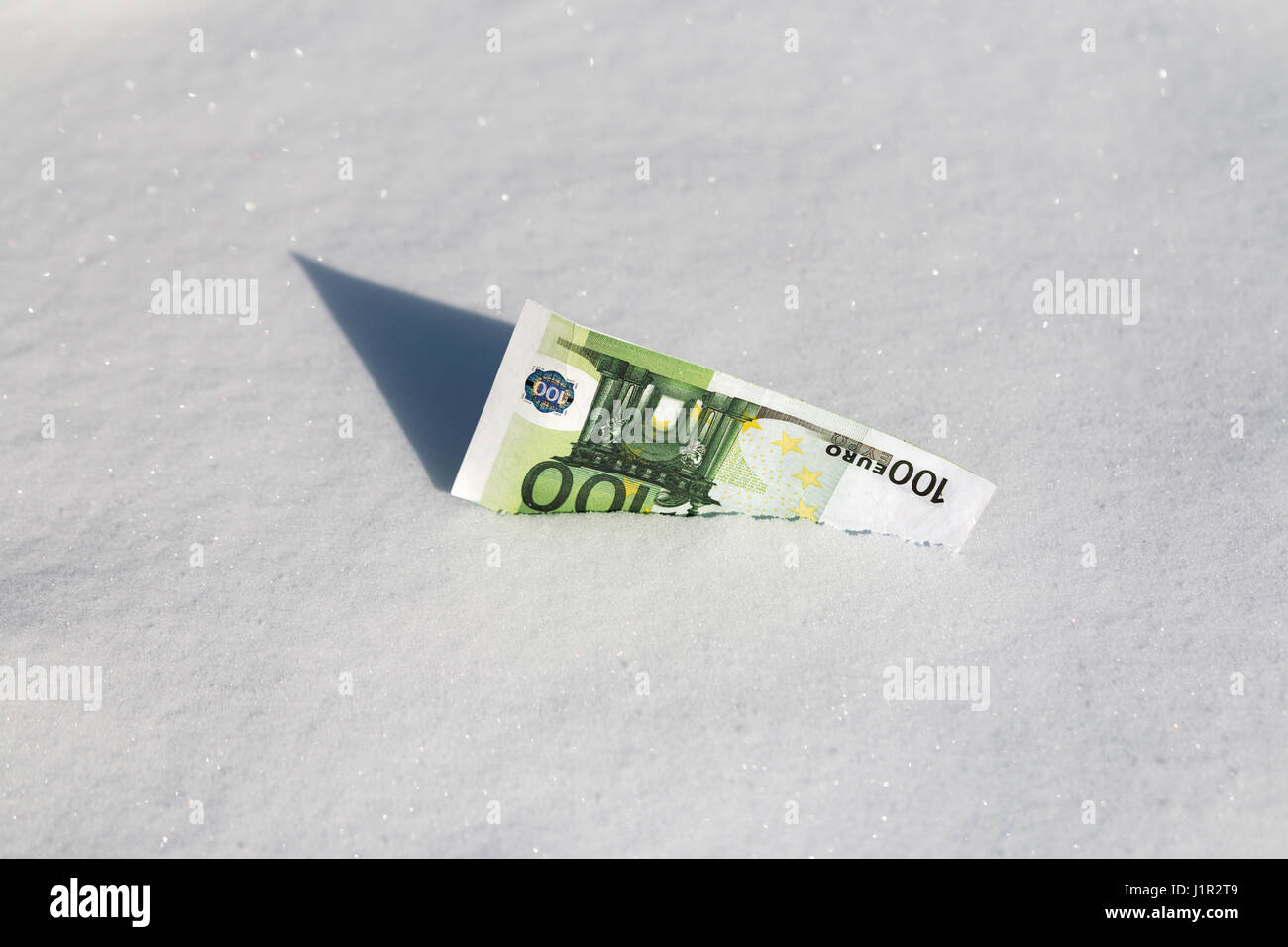 one hundred euro stuck in Snow White Stock Photo - Alamy