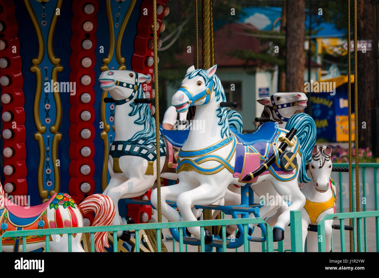 the carousel horses in the recreation park Stock Photo - Alamy