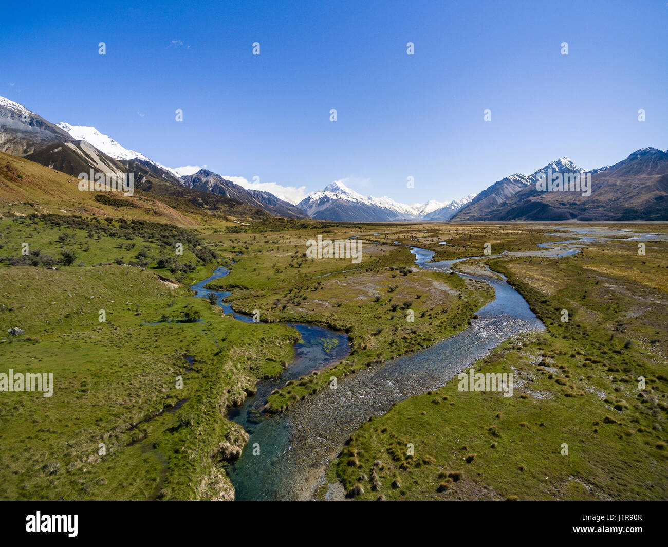 Wide river bed of the Tasman River, at back Mount Cook, Mount Cook ...