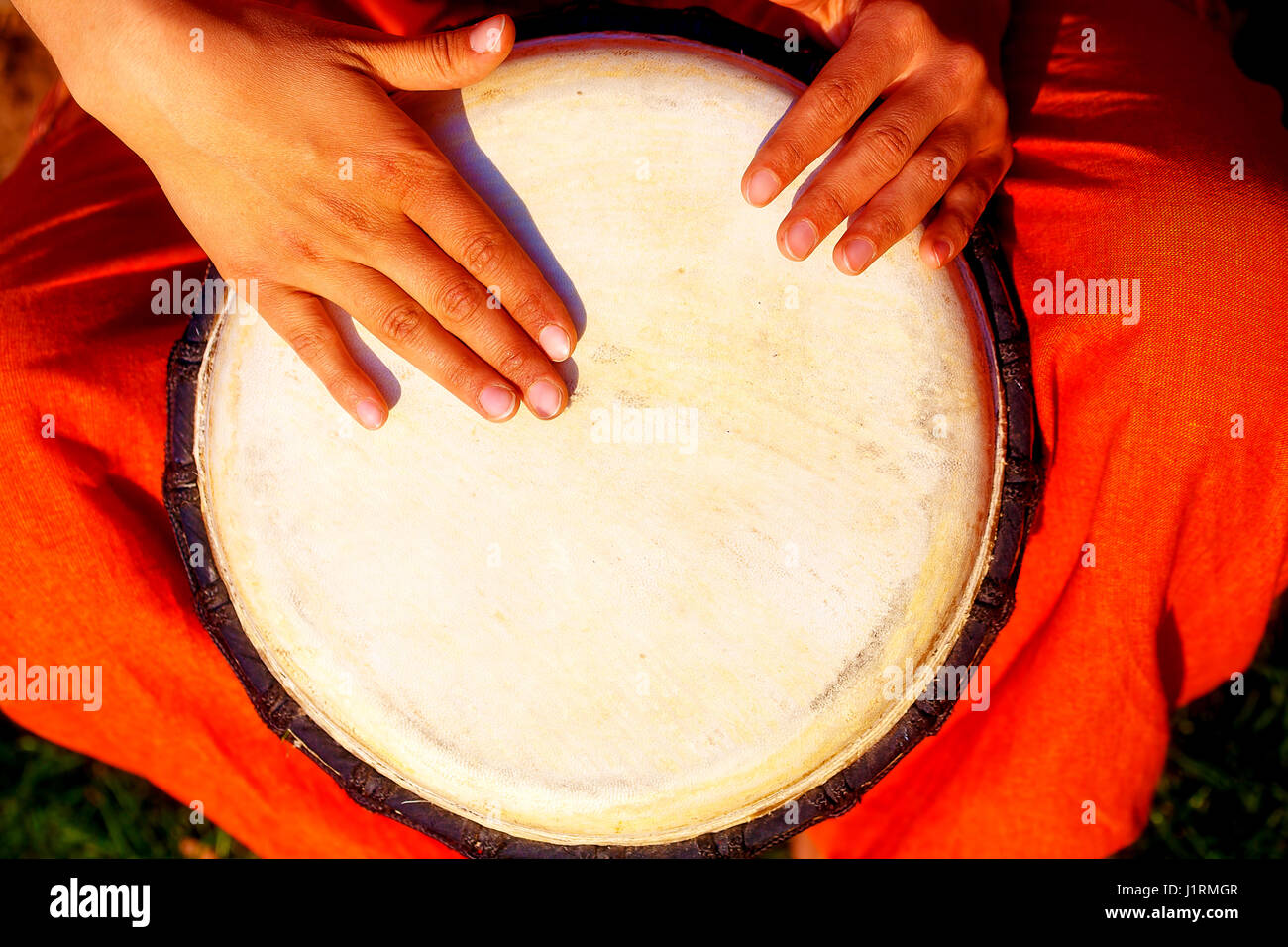 Young lady drummer with her djembe drum Stock Photo - Alamy