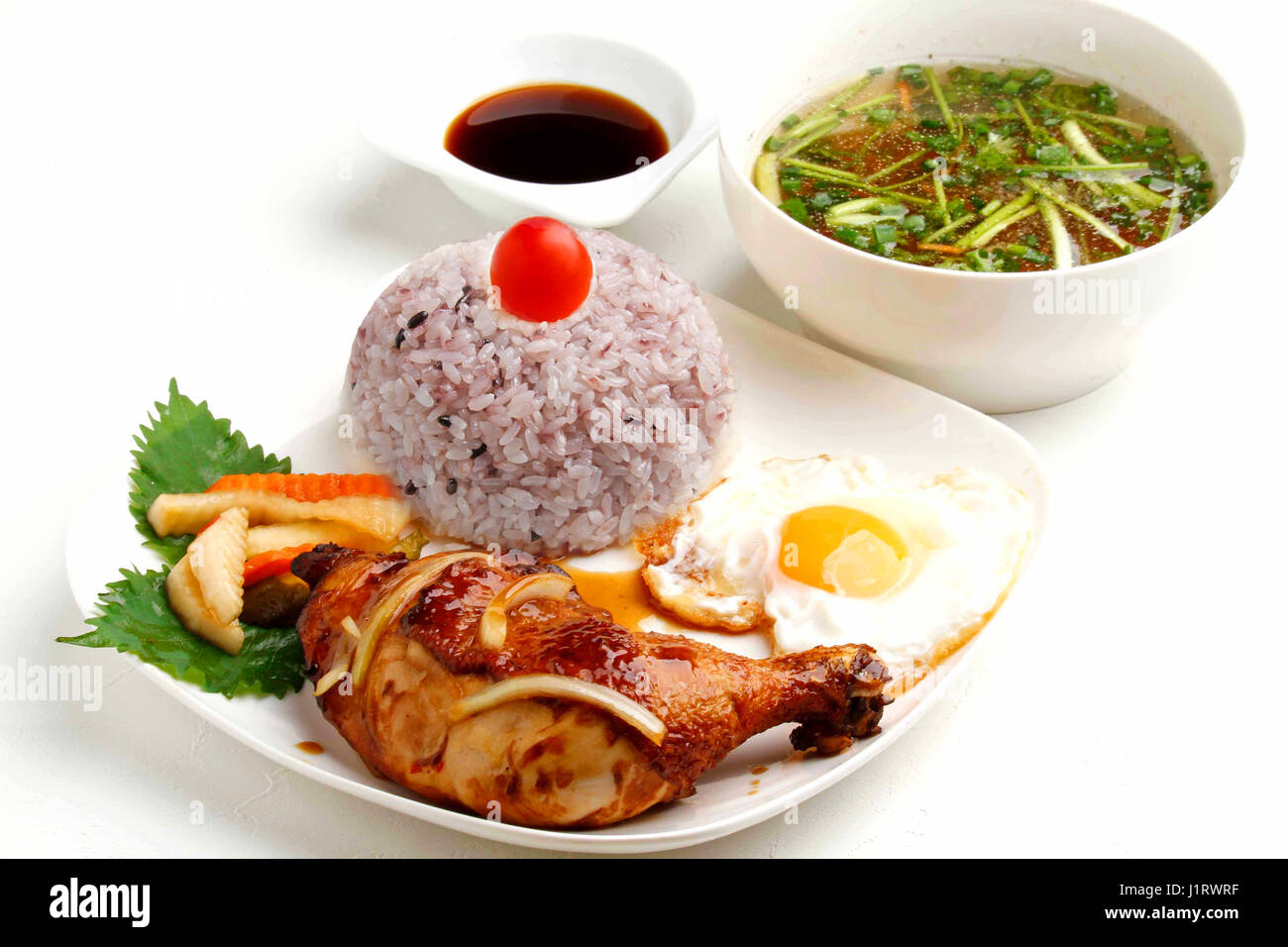 Vietnamese lunch set of rice with fried chicken legs Stock Photo - Alamy