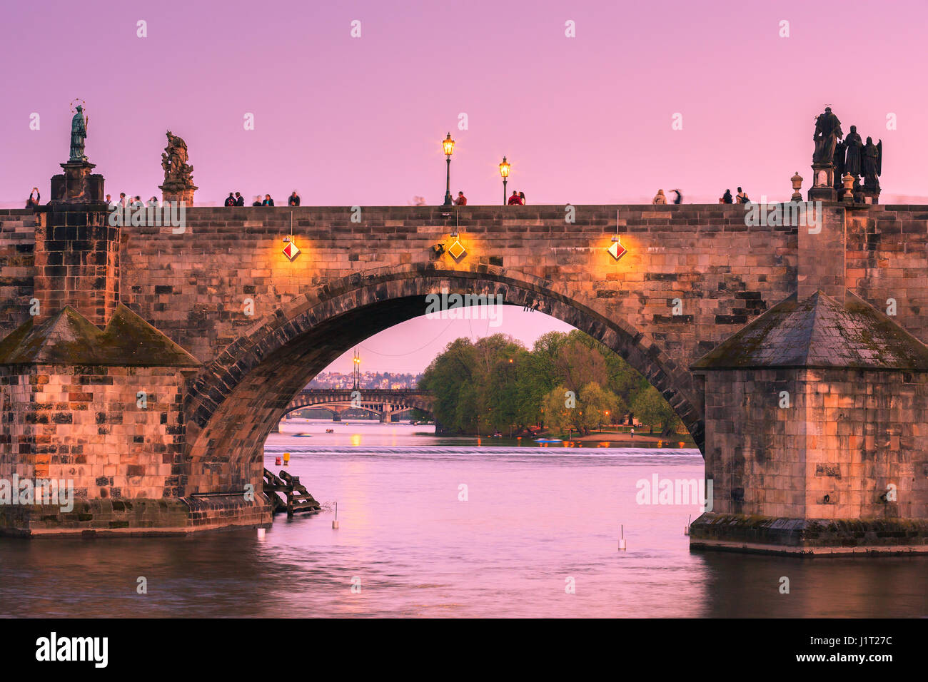 The famous Charles Bridge at sunset in Prague in the Czech Republic ...