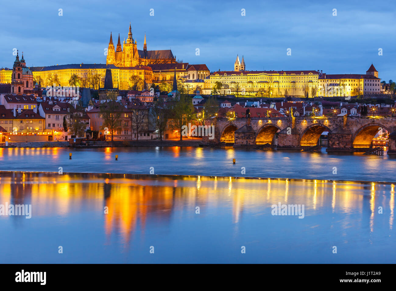 Classic view of Prague Castle and Charles Bridge. Taken at sunset in ...