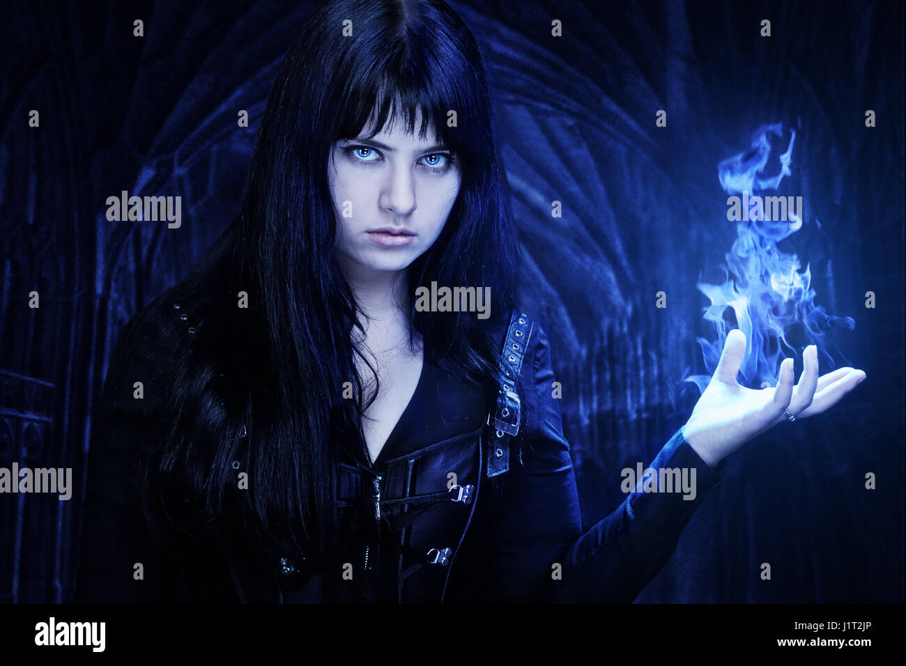 Woman with fire in her hand Stock Photo - Alamy