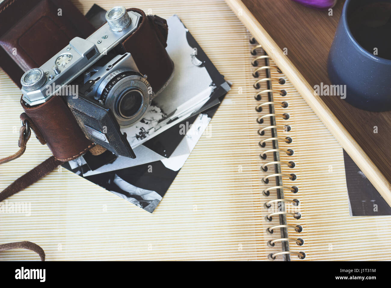 Old retro camera on aged photo album - abstract background Stock Photo ...