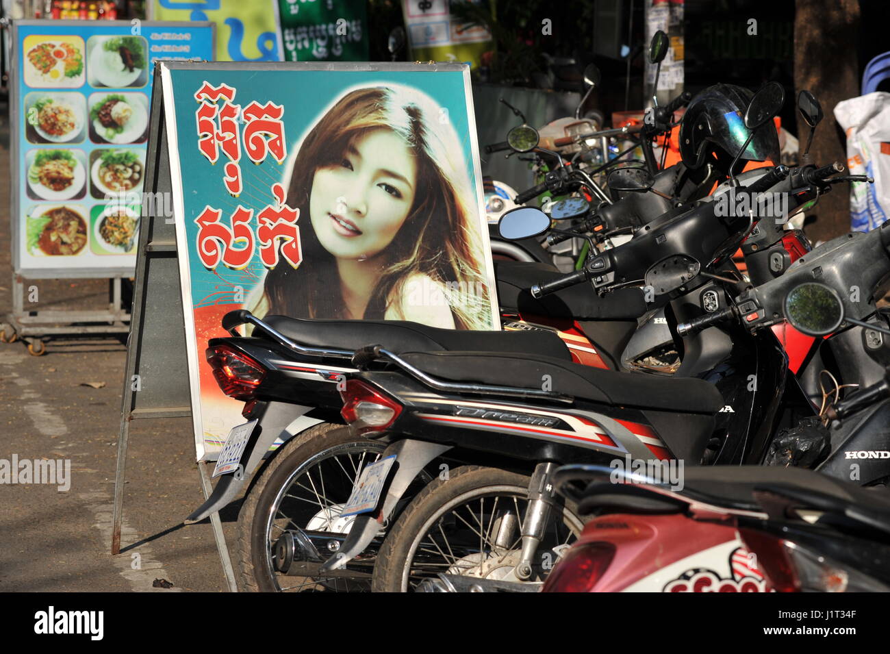 Khmer advertising, it must work, look at all the motos, Phnom Penh ...