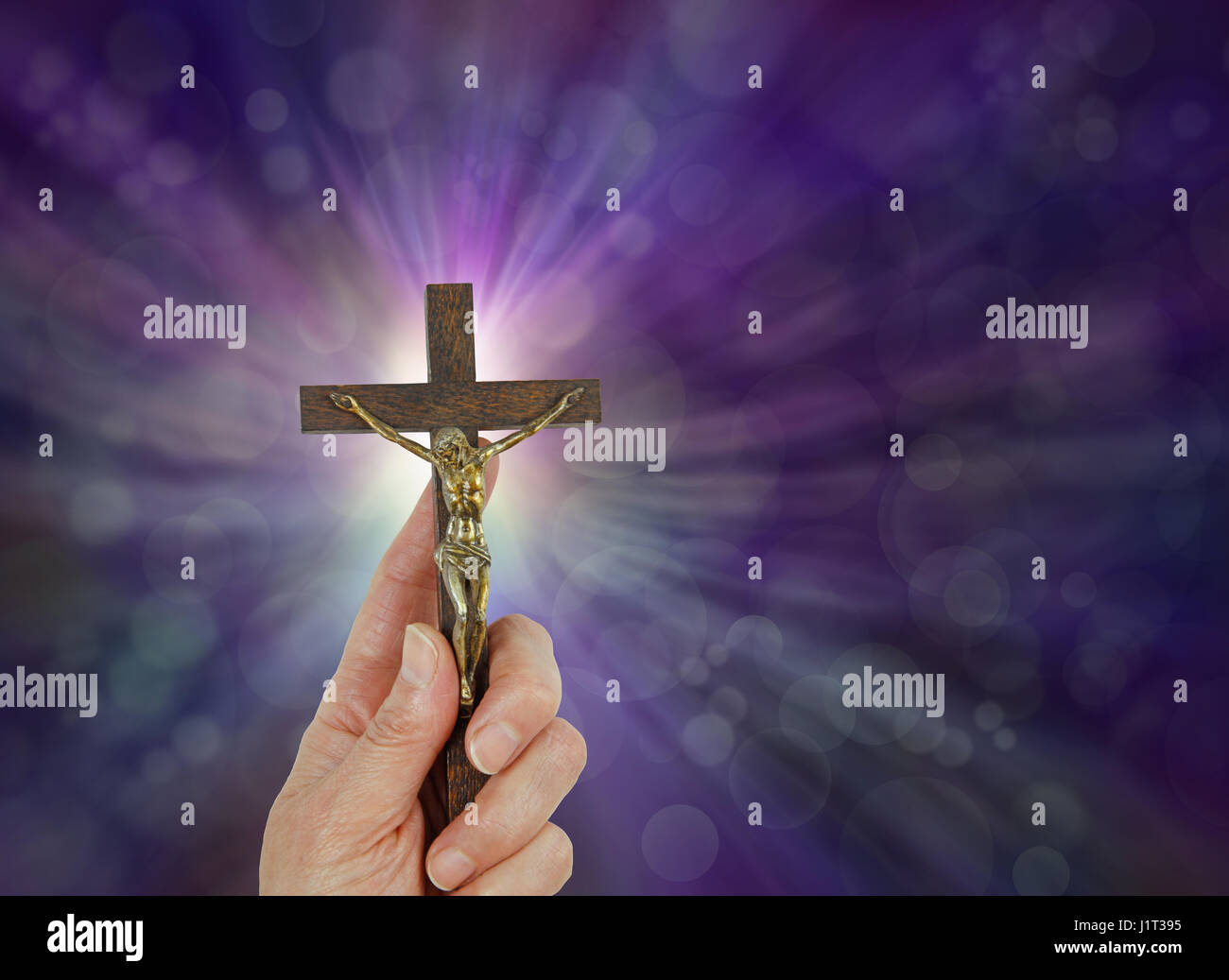 The Greatest Love - Female hand holding a Crucifix of Jesus Christ up ...