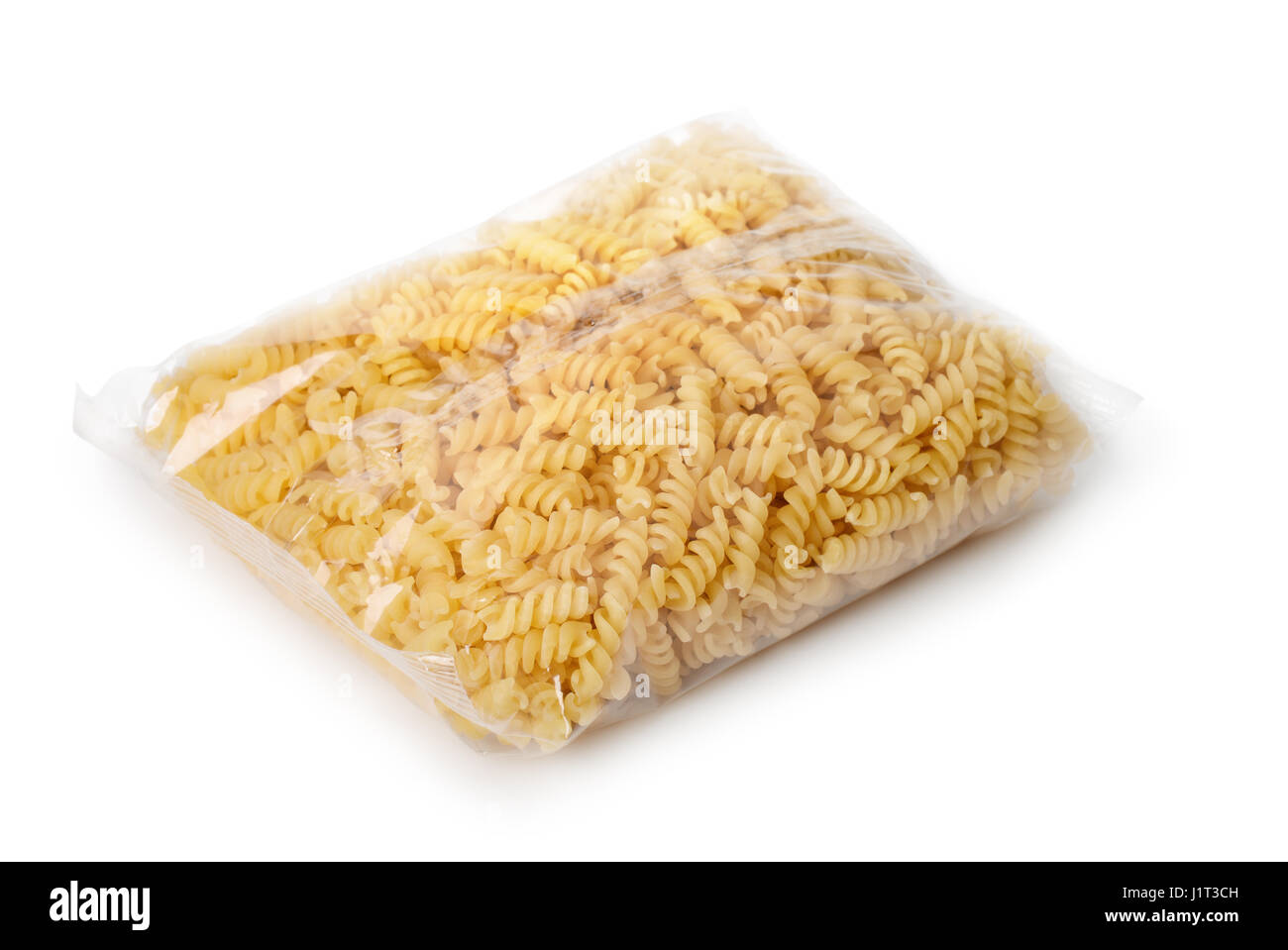 Transparent plastic bag of fusilli pasta isolated on white Stock Photo ...