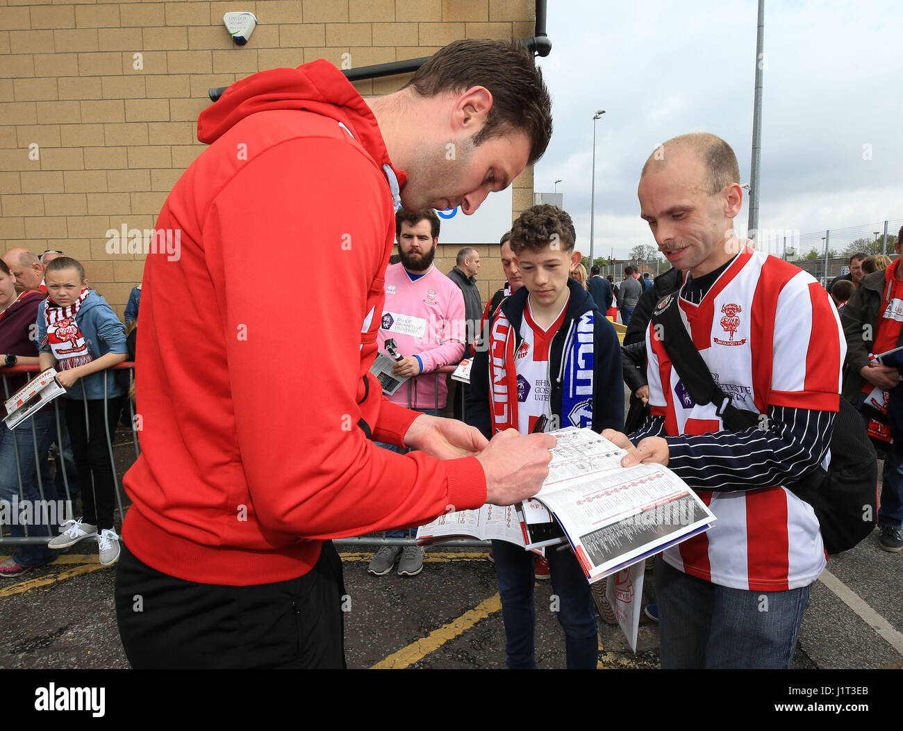 Lincoln City's Jamie McCombe signs autographs before the Vanarama ...