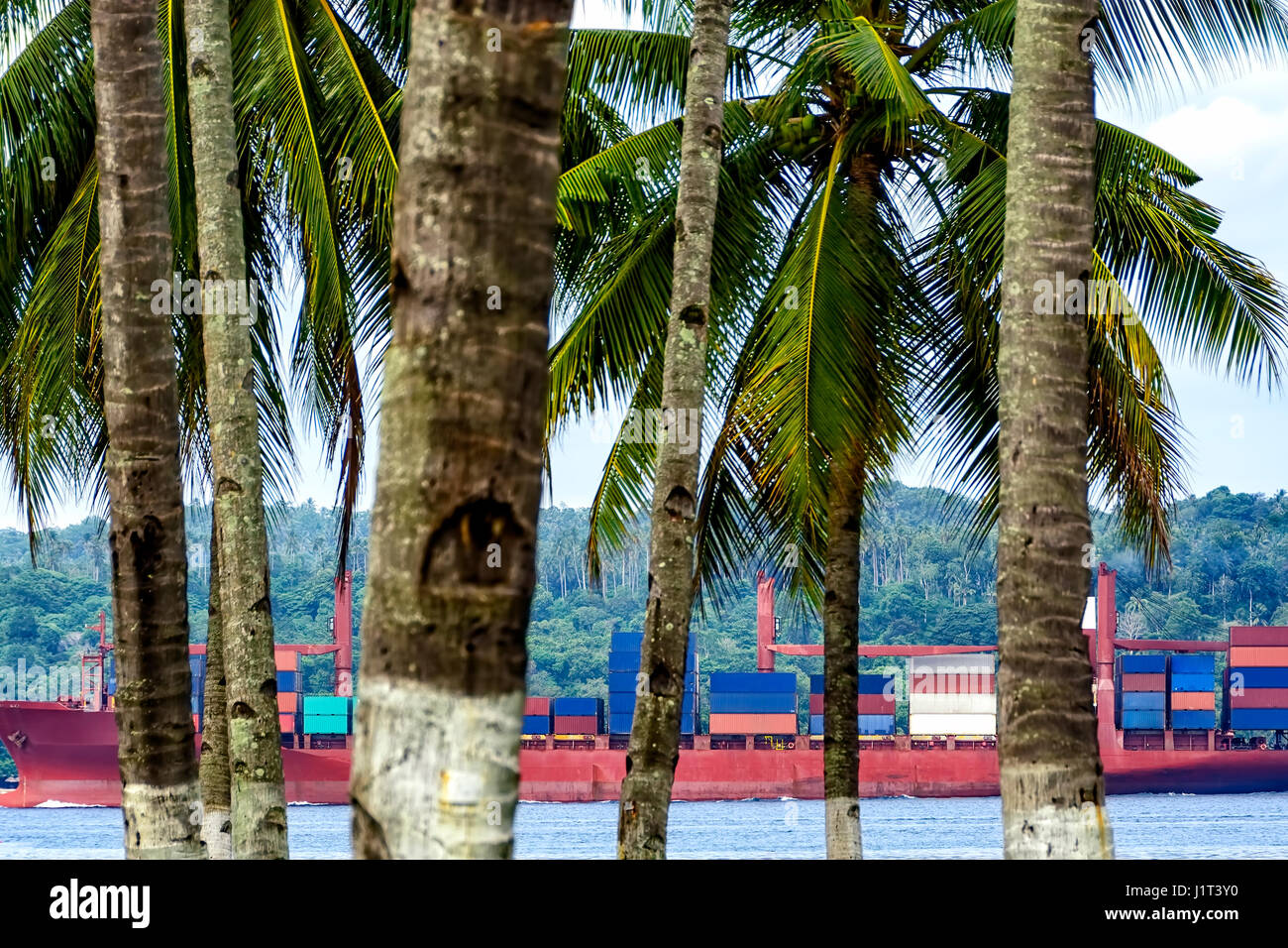 Container cargo ship passing thru canal, Philippines Stock Photo - Alamy