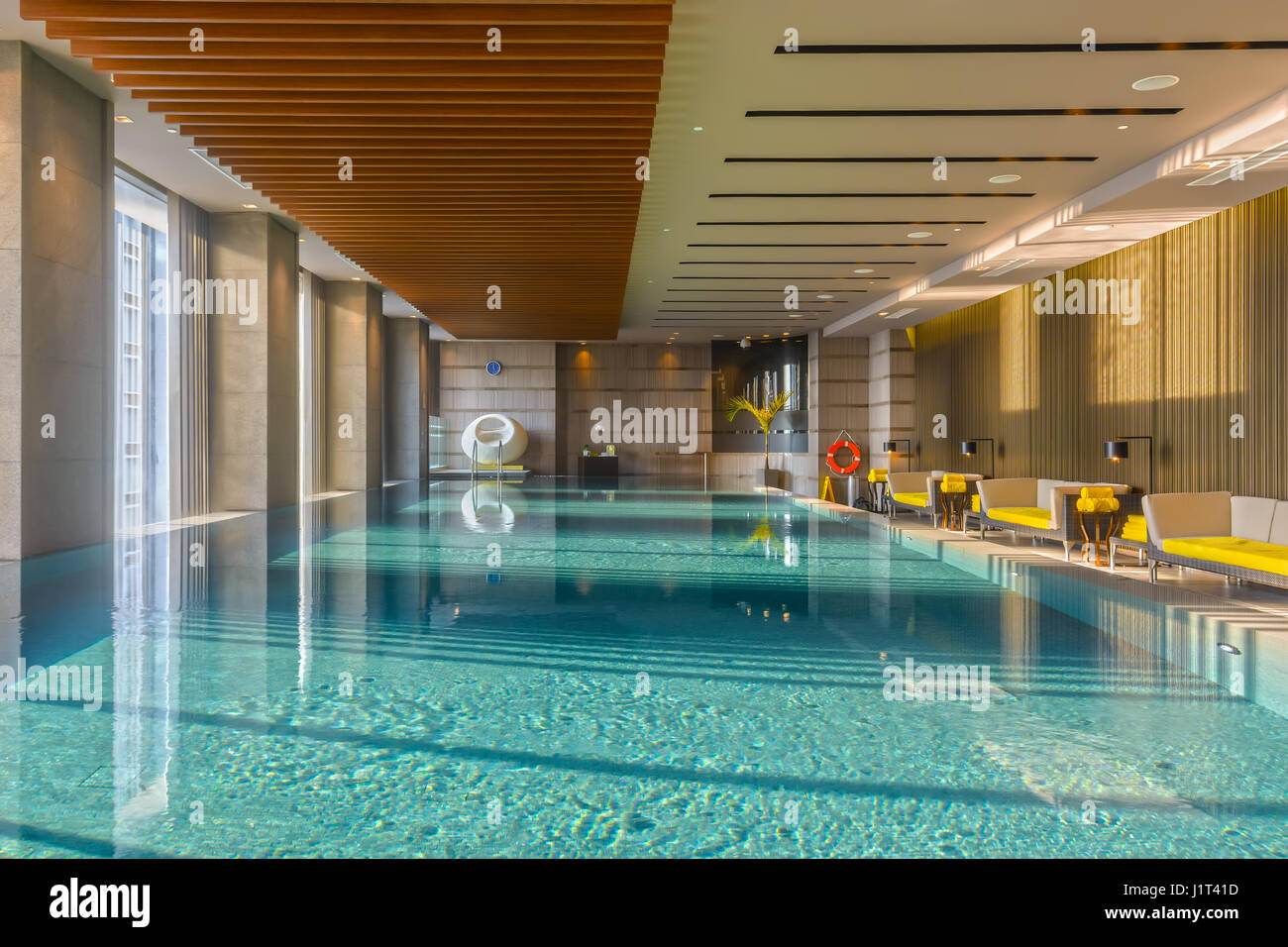 Sunlight streaming in interior swimming pool Stock Photo - Alamy