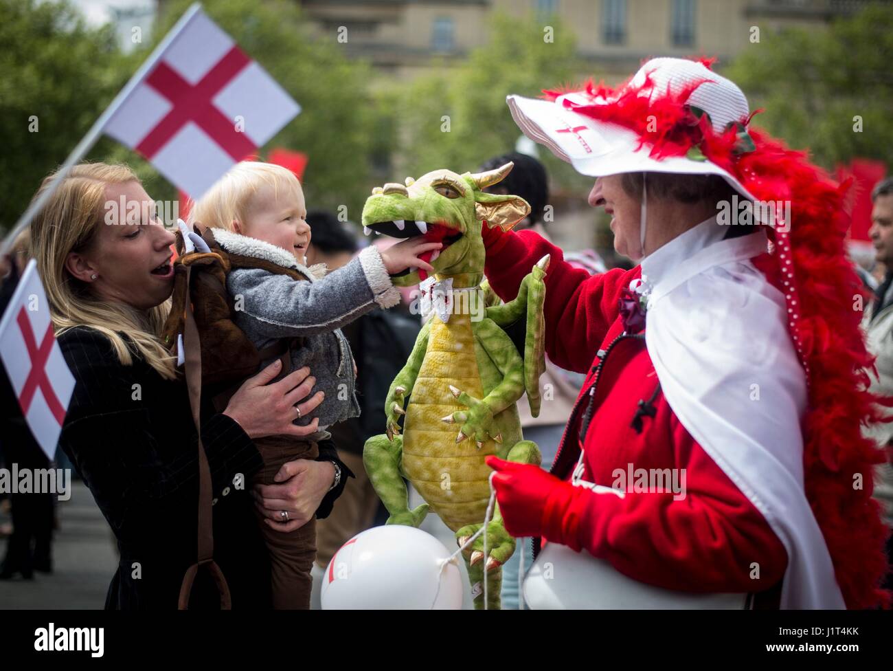 A child plays with a toy dragon during St George's Day celebrations at ...
