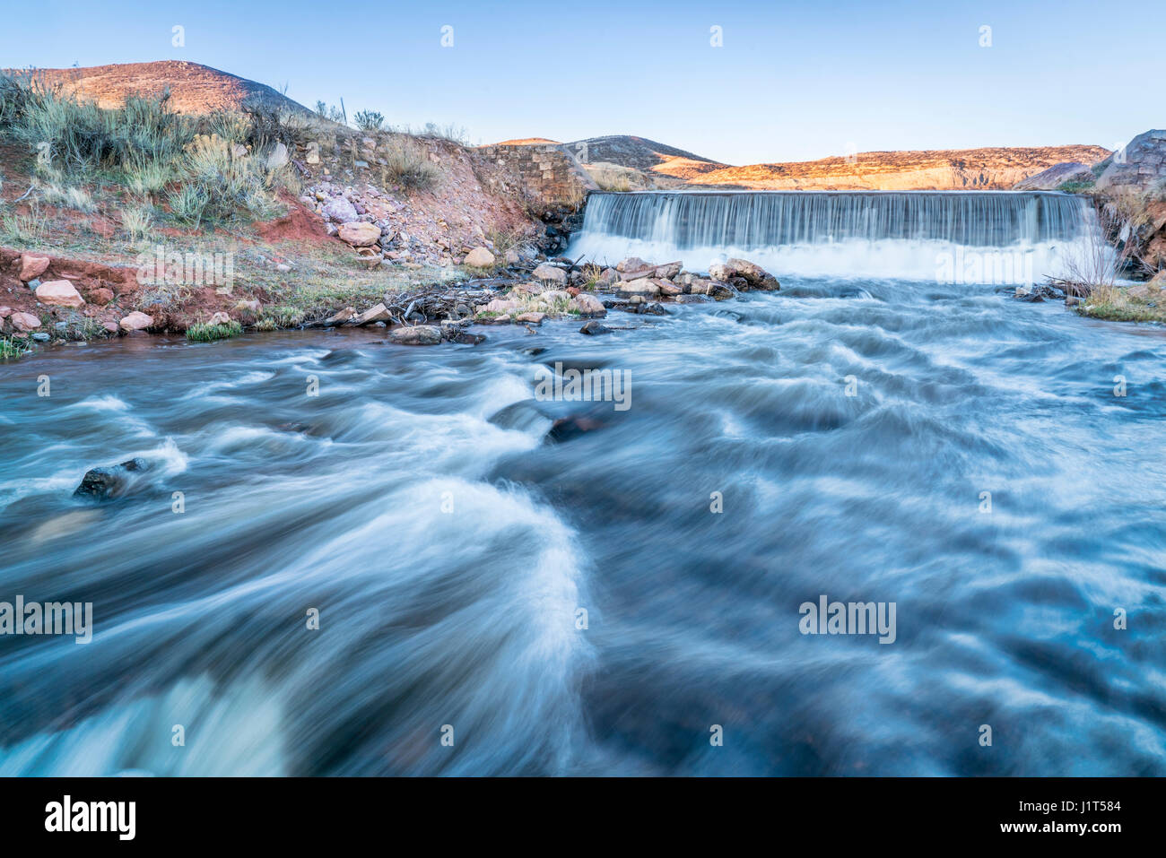 a small dam in northern Colorado foothills - Park Creek is running the ...