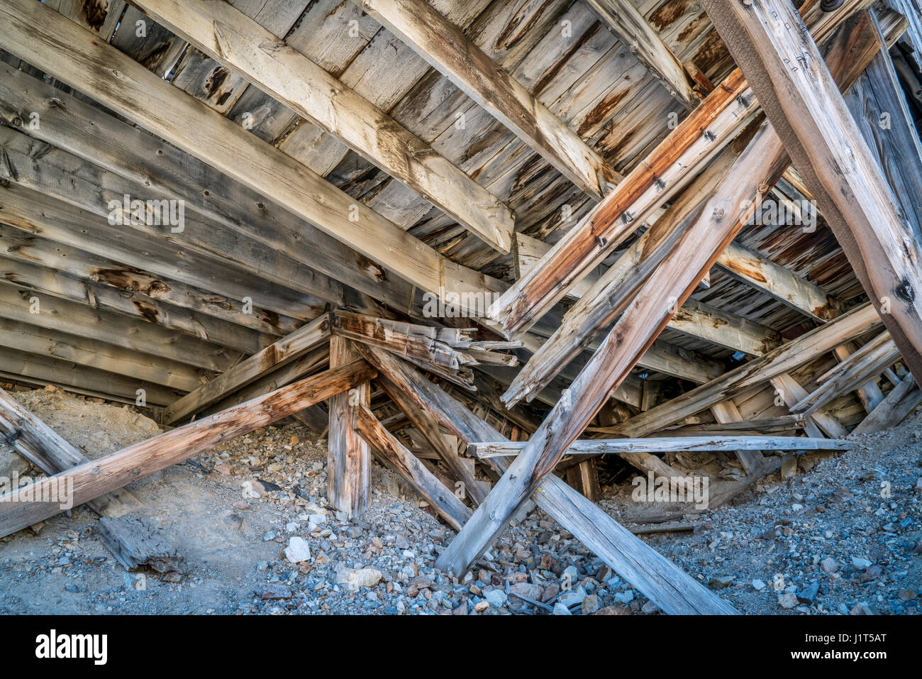 collapsed wooden buiding of a gold mine in Rocky Mountains, Colorado ...