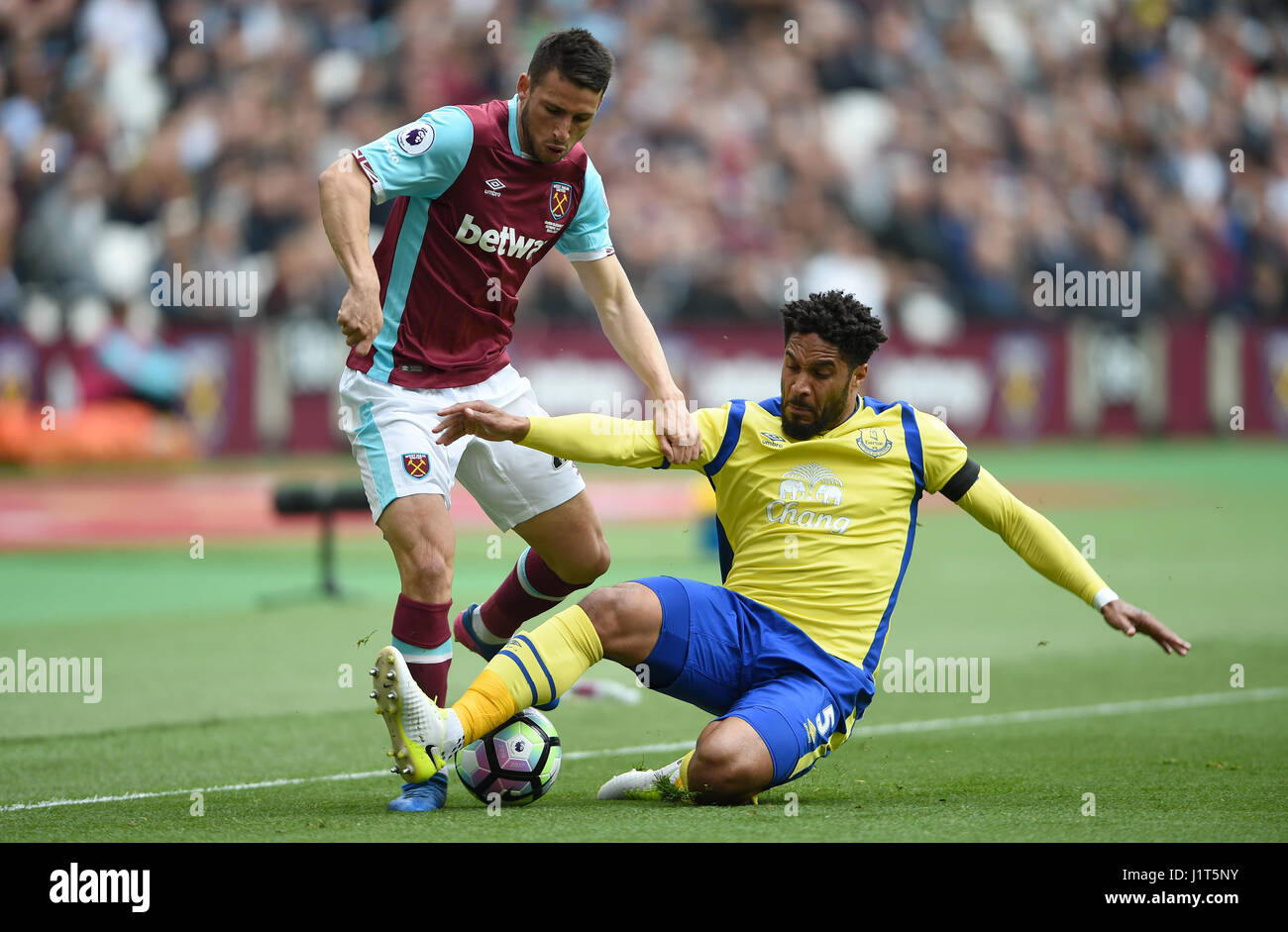 West Ham United's Jonathan Calleri (left) and Everton's Ashley Williams ...