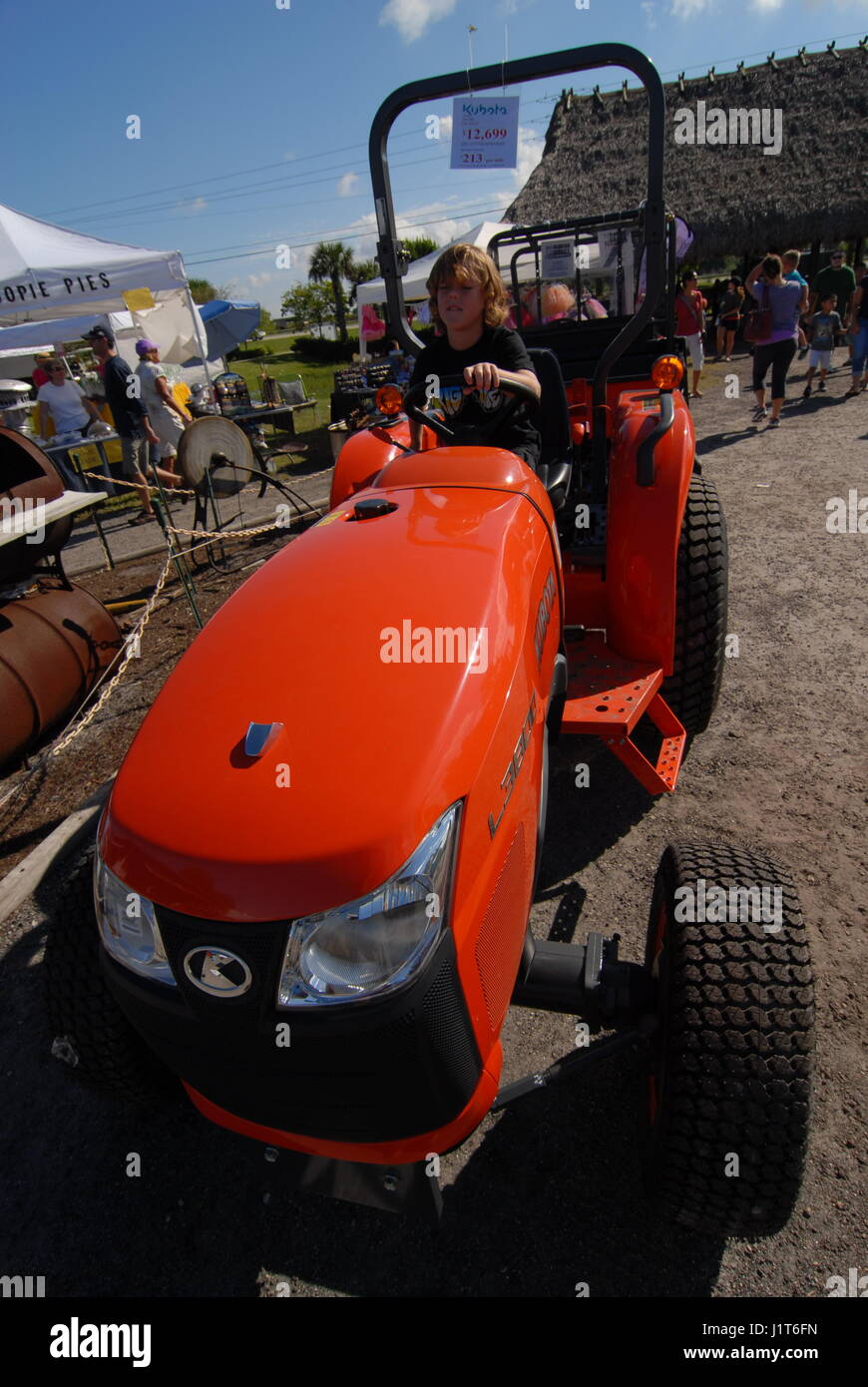 families at a farm tractor event Stock Photo - Alamy