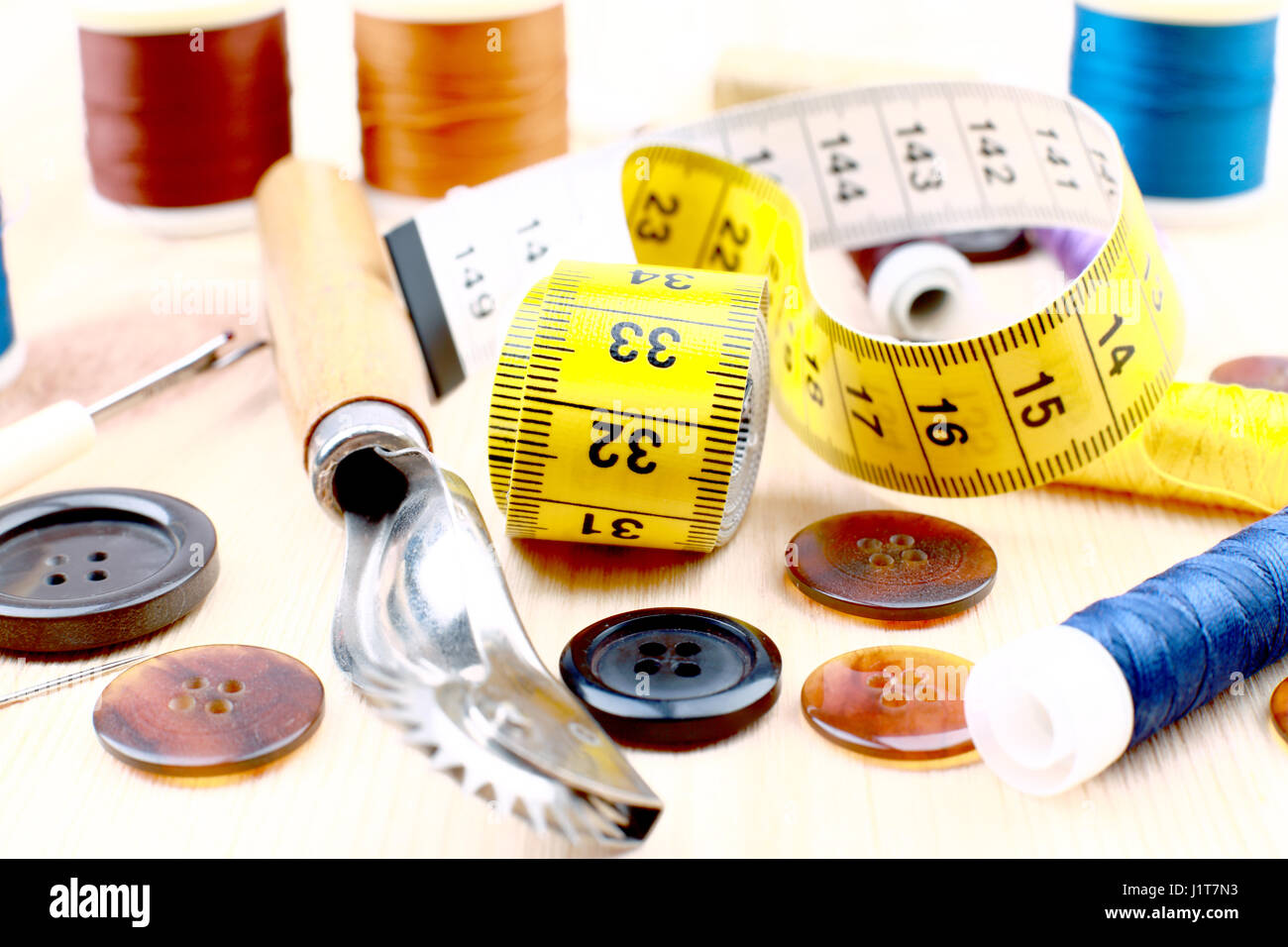 various type of sewing items on wood background Stock Photo - Alamy