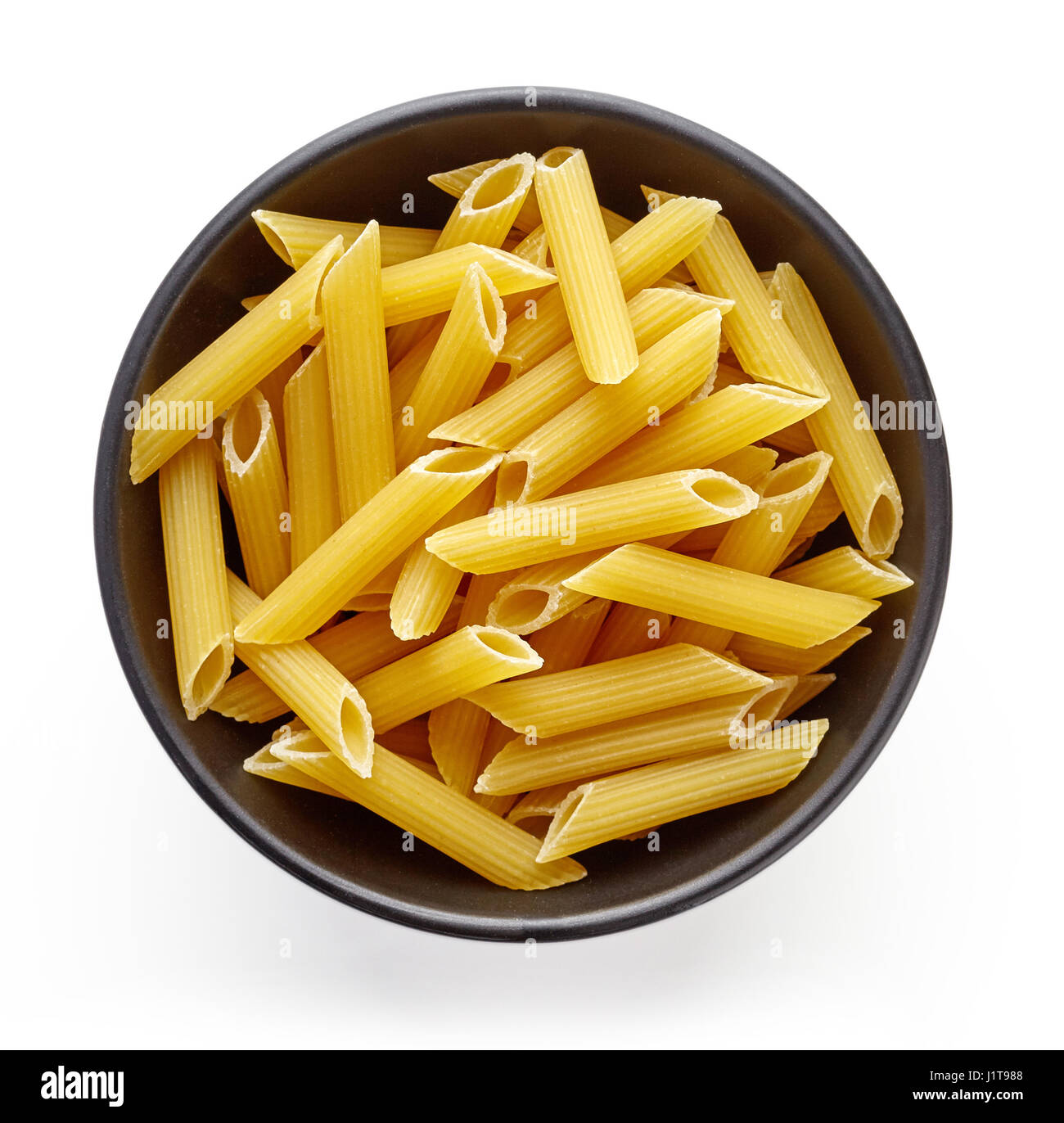 penne pasta in bowl, isolated on white background, top view Stock Photo ...