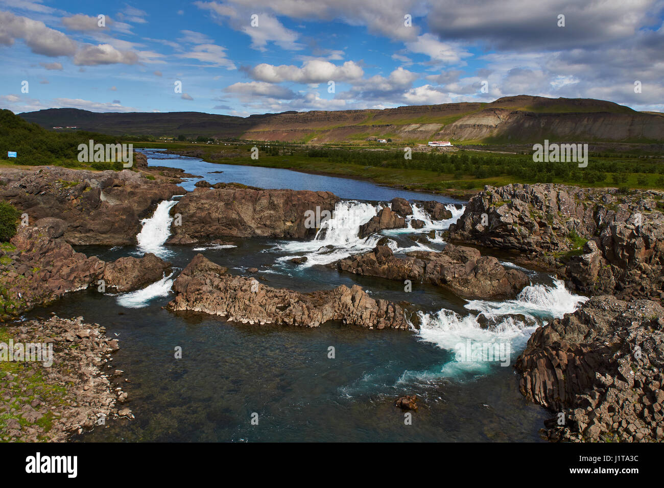Glanni Waterfall near Grabrokarhraun lava field and the small village ...