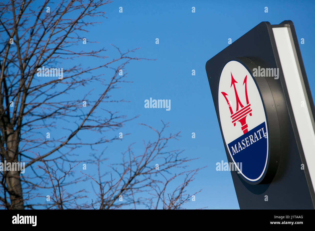 A logo sign outside of a Maserati car dealership in Oakville, ON ...