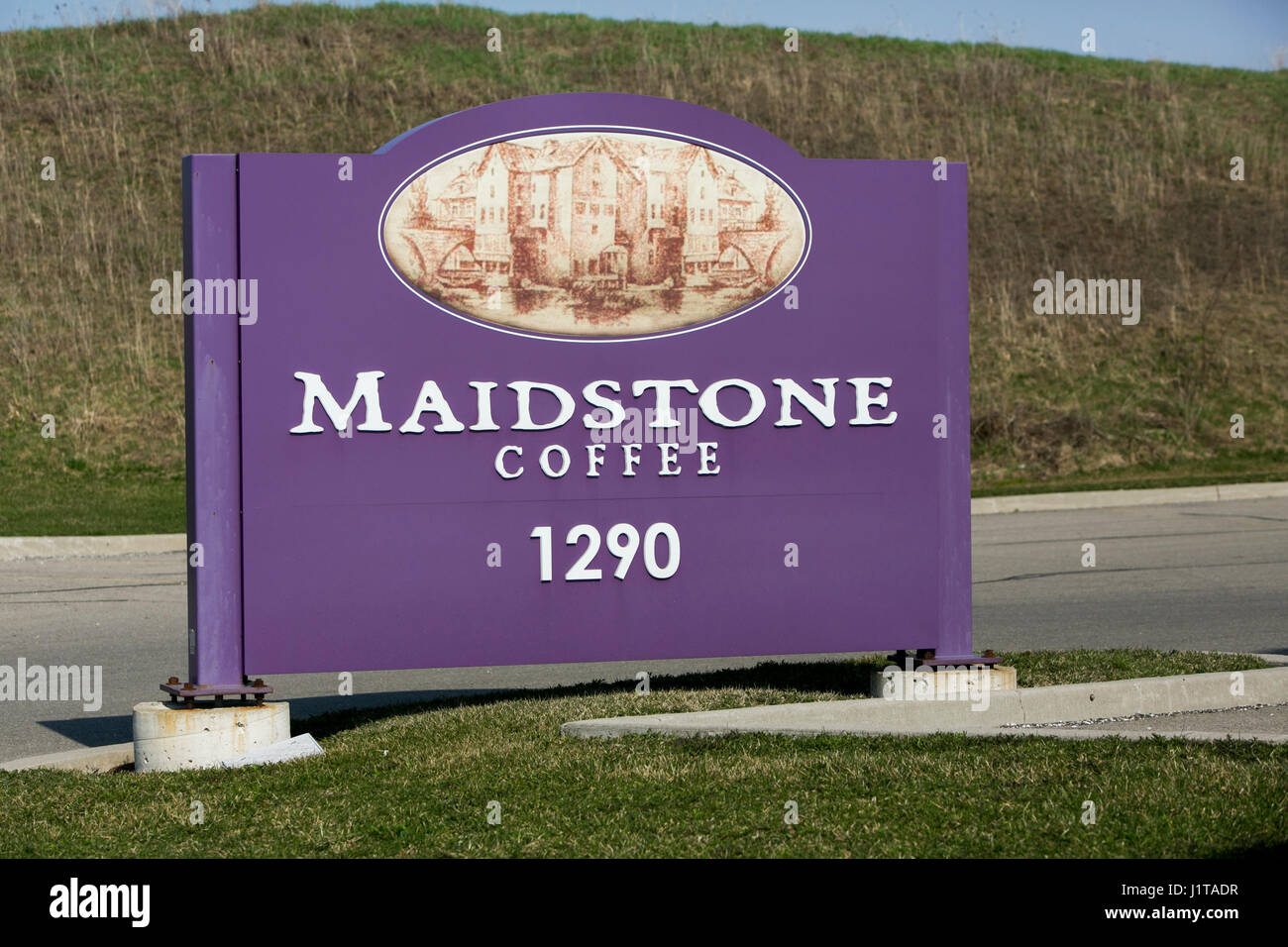 A logo sign outside of a facility occupied by Maidstone Coffee in ...