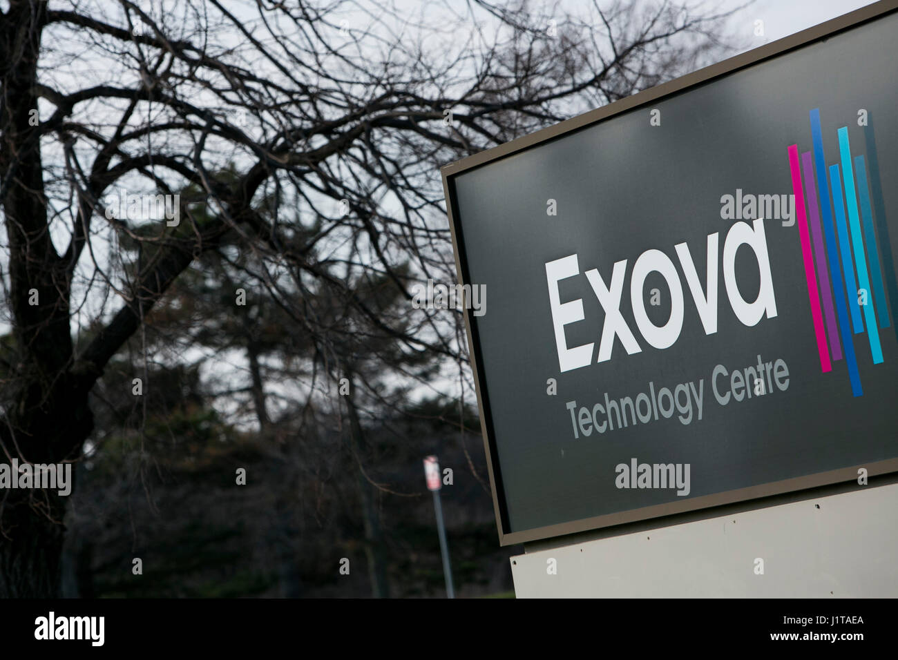 A logo sign outside of a facility occupied by the Exova Group in ...