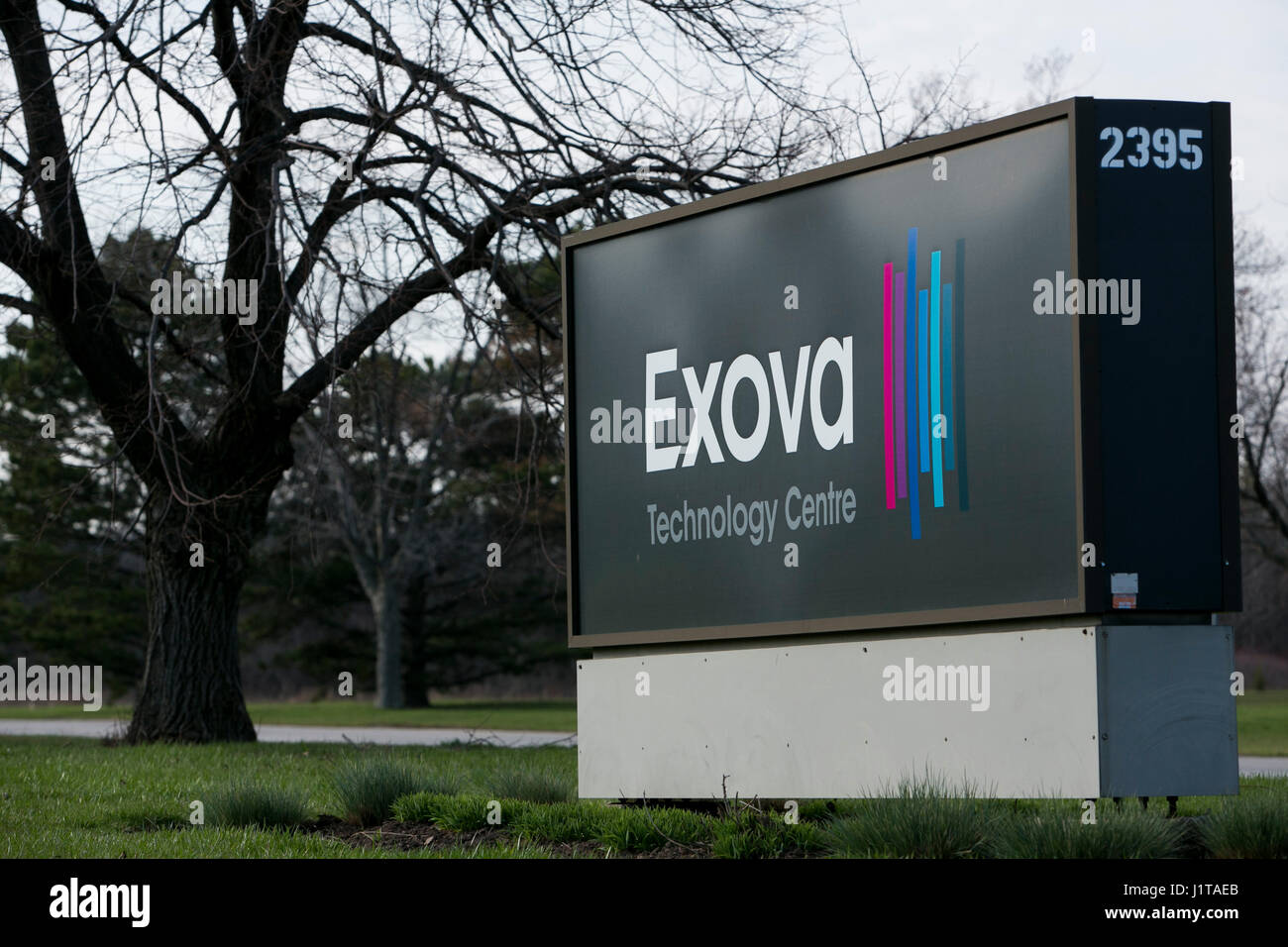 A logo sign outside of a facility occupied by the Exova Group in ...