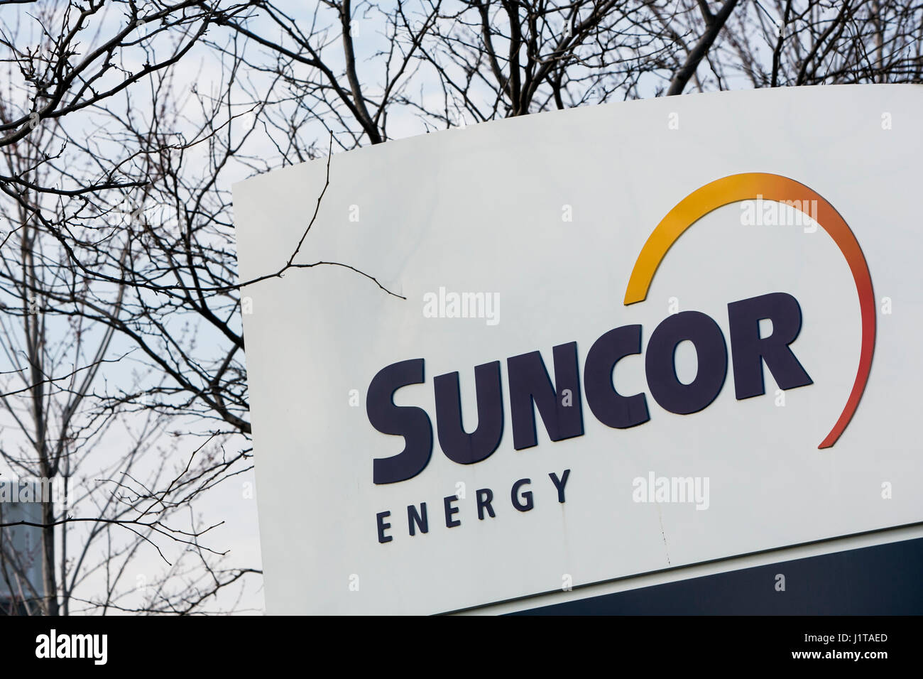 A logo sign outside of a facility occupied by Suncor Energy in ...
