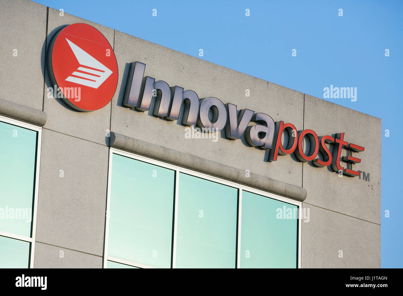 A logo sign outside of a facility occupied by Innovapost in Mississauga ...