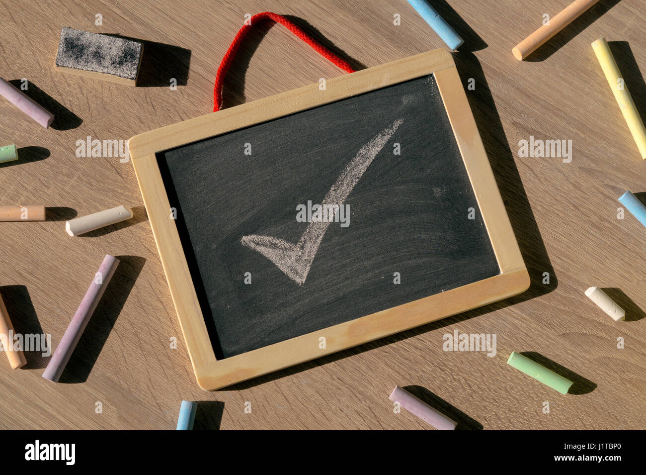 Check. Blackboard. Colorful chalks Stock Photo - Alamy