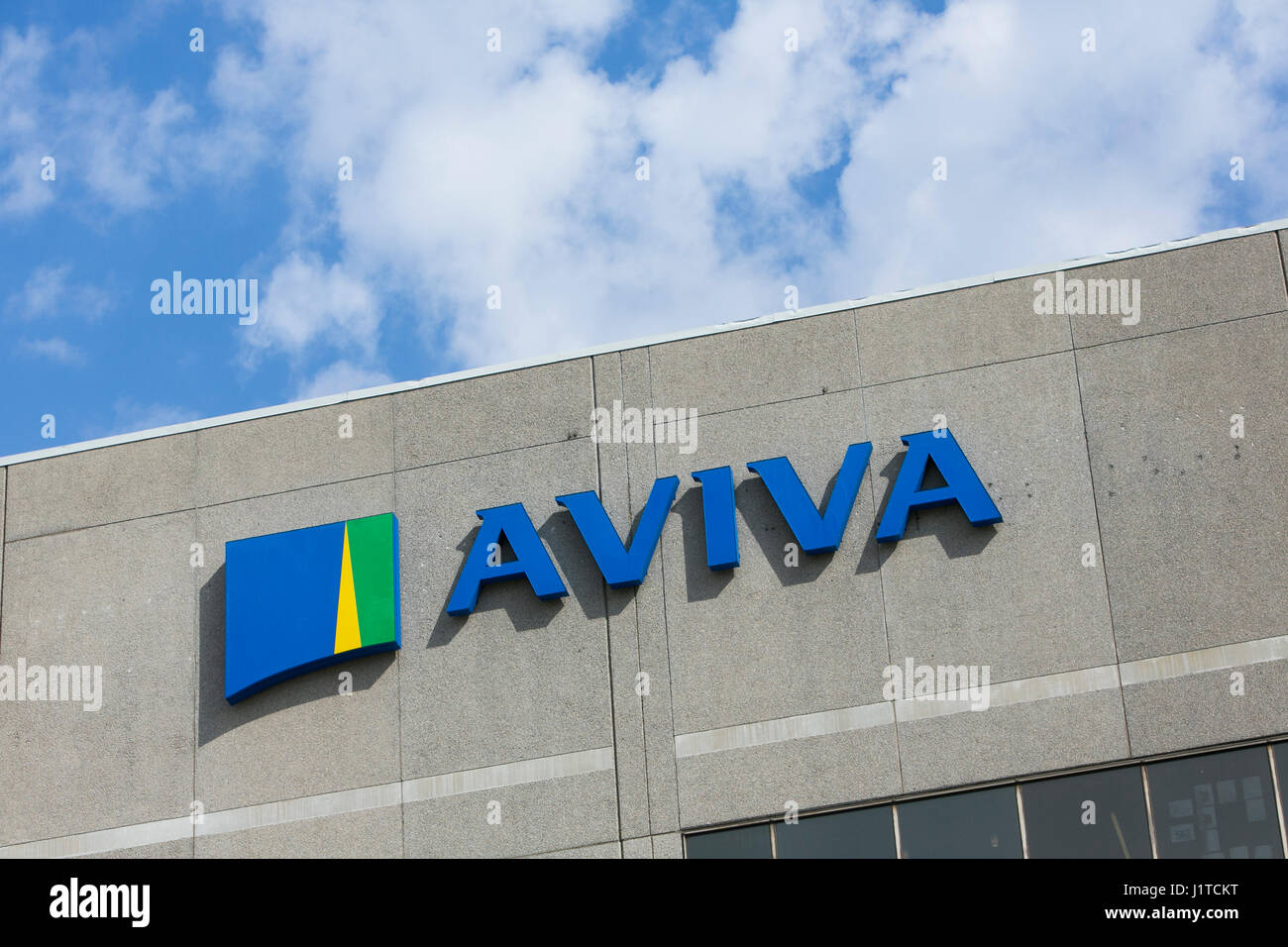 A logo sign outside of a facility occupied by Aviva in Mississauga ...