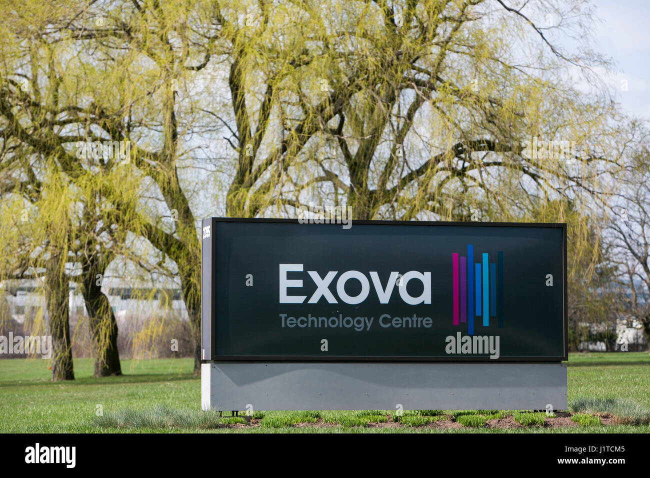 A logo sign outside of facility occupied by the Exova Group in ...
