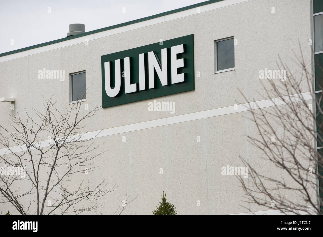 A logo sign outside of facility occupied by Uline in Brampton, Ontario ...