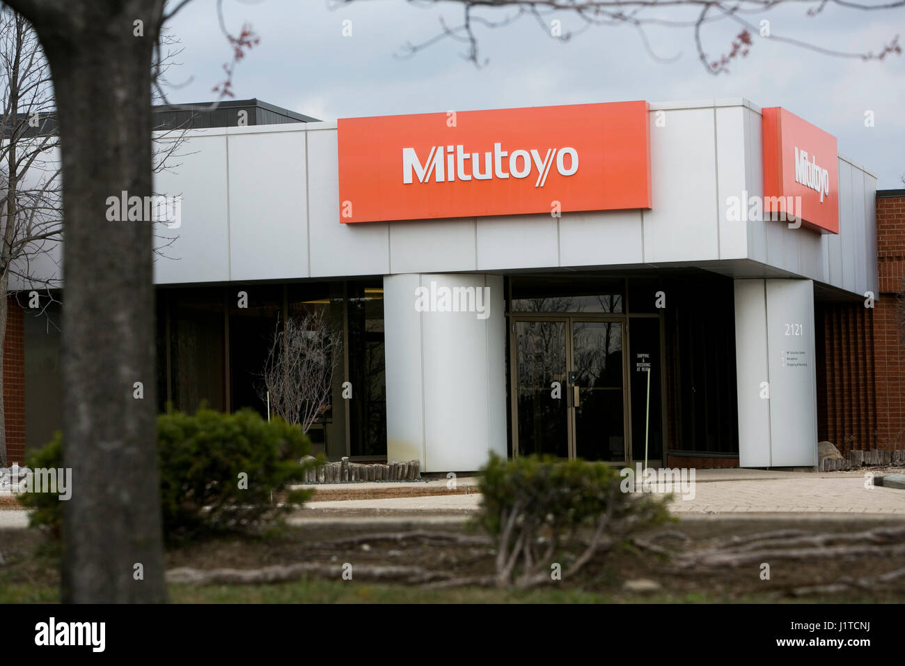 A logo sign outside of a facility occupied by the Mitutoyo Corporation ...